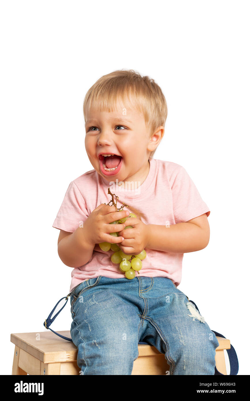 Boy eating grapes child hi-res stock photography and images - Alamy