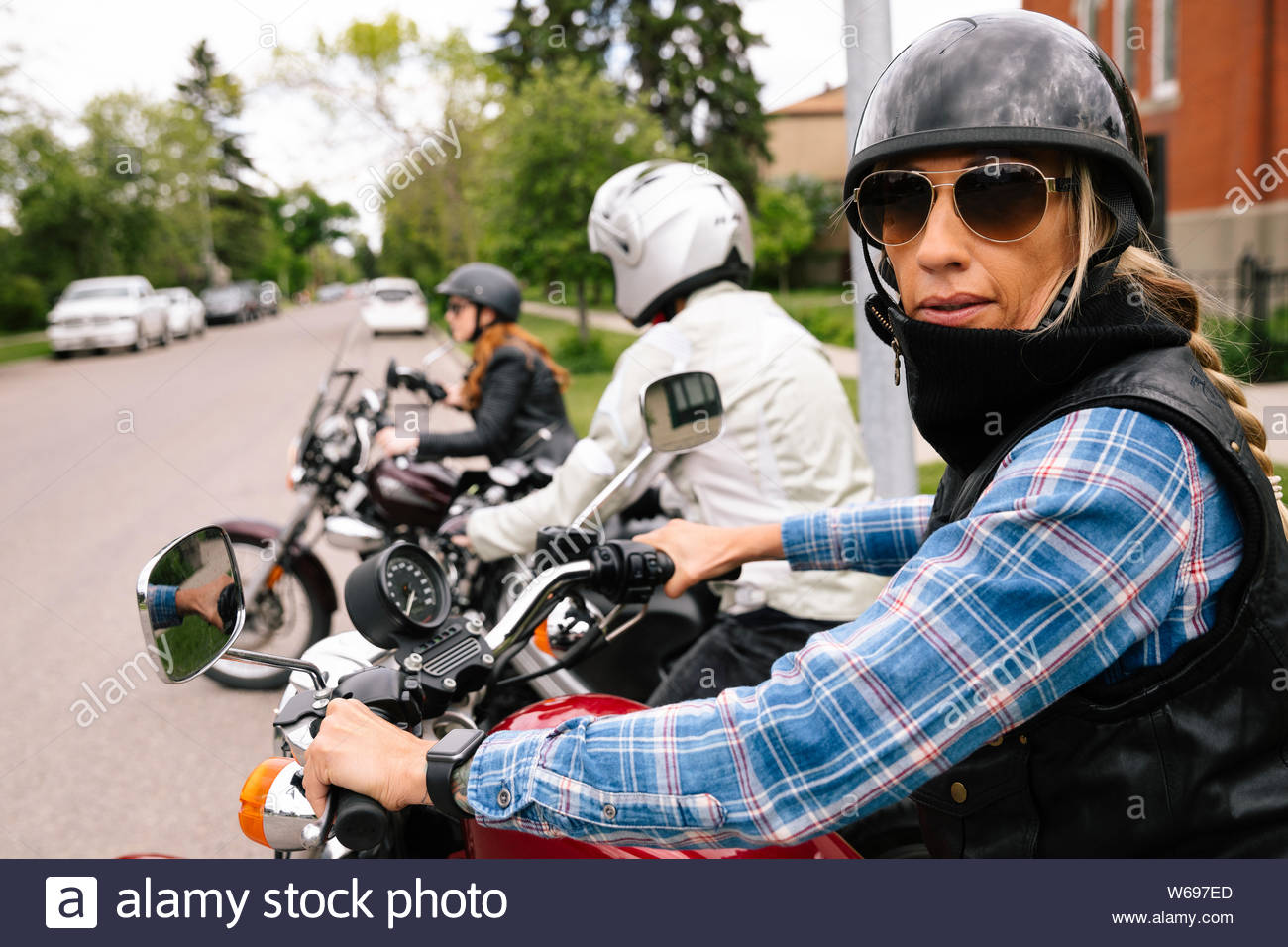 Mature woman riding motorcycle hi-res stock photography and images - Alamy