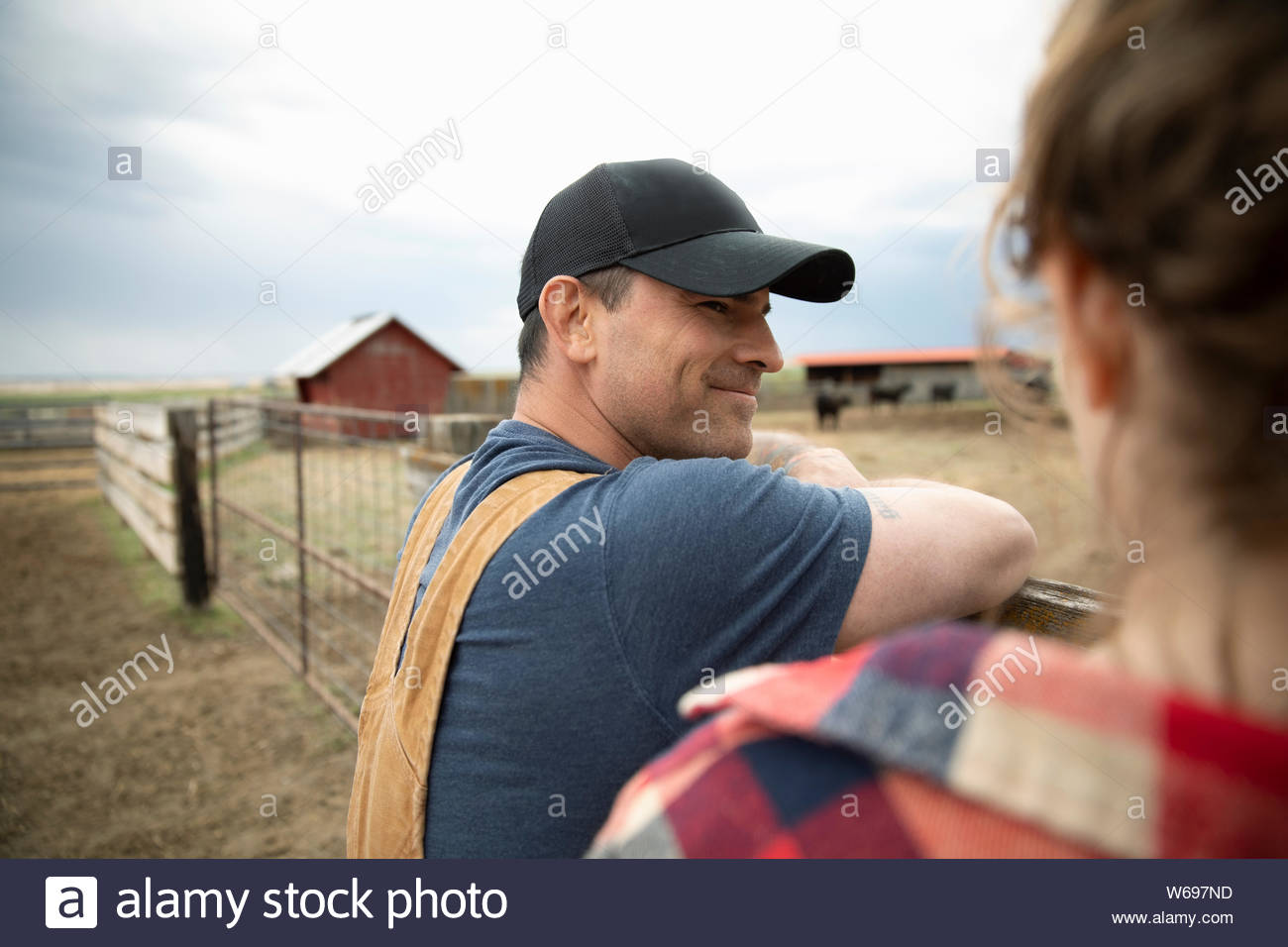 Smiling male rancher with wife Stock Photo - Alamy