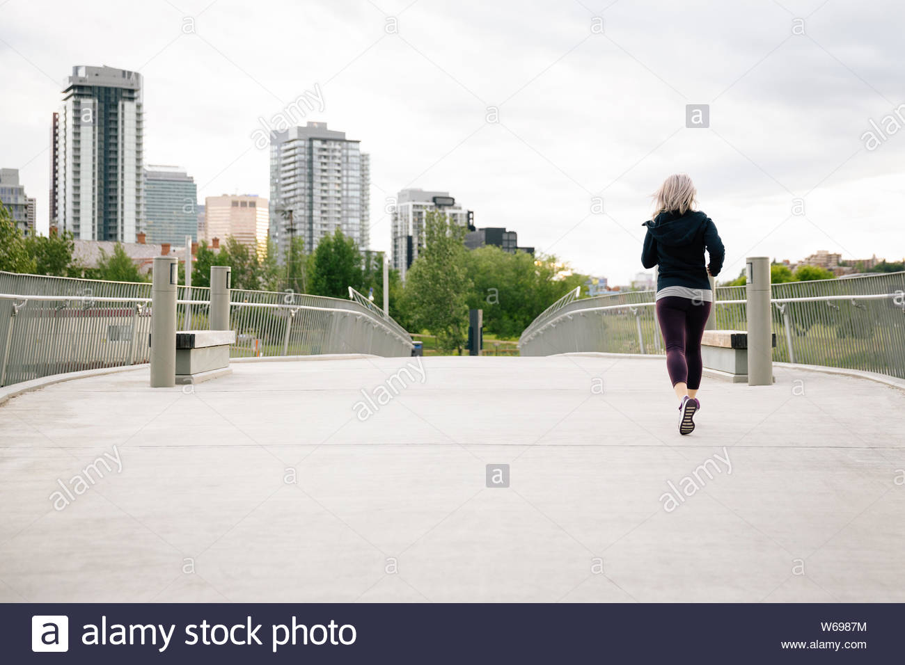 Woman mature running outdoors park hi-res stock photography and images ...