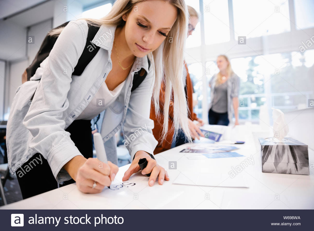 University student writing hi-res stock photography and images - Alamy