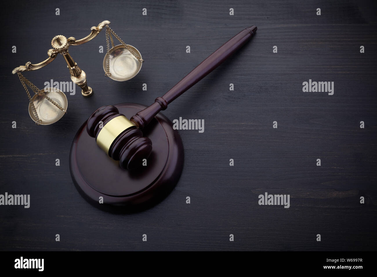 Judges Gavel And Scale Of Justice On The Black Table Background. Law ...