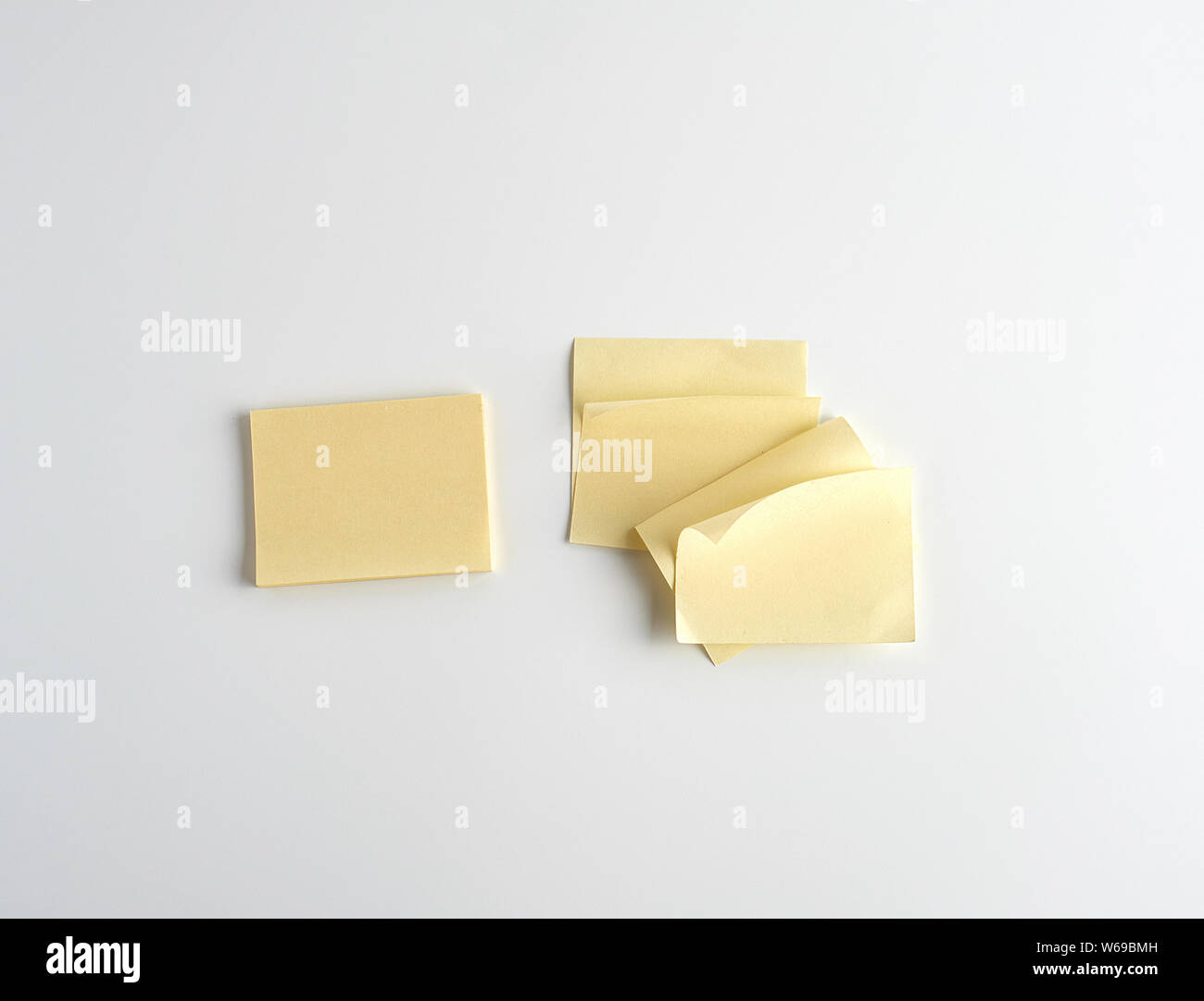 stack of yellow paper stickers on white background, close up Stock ...