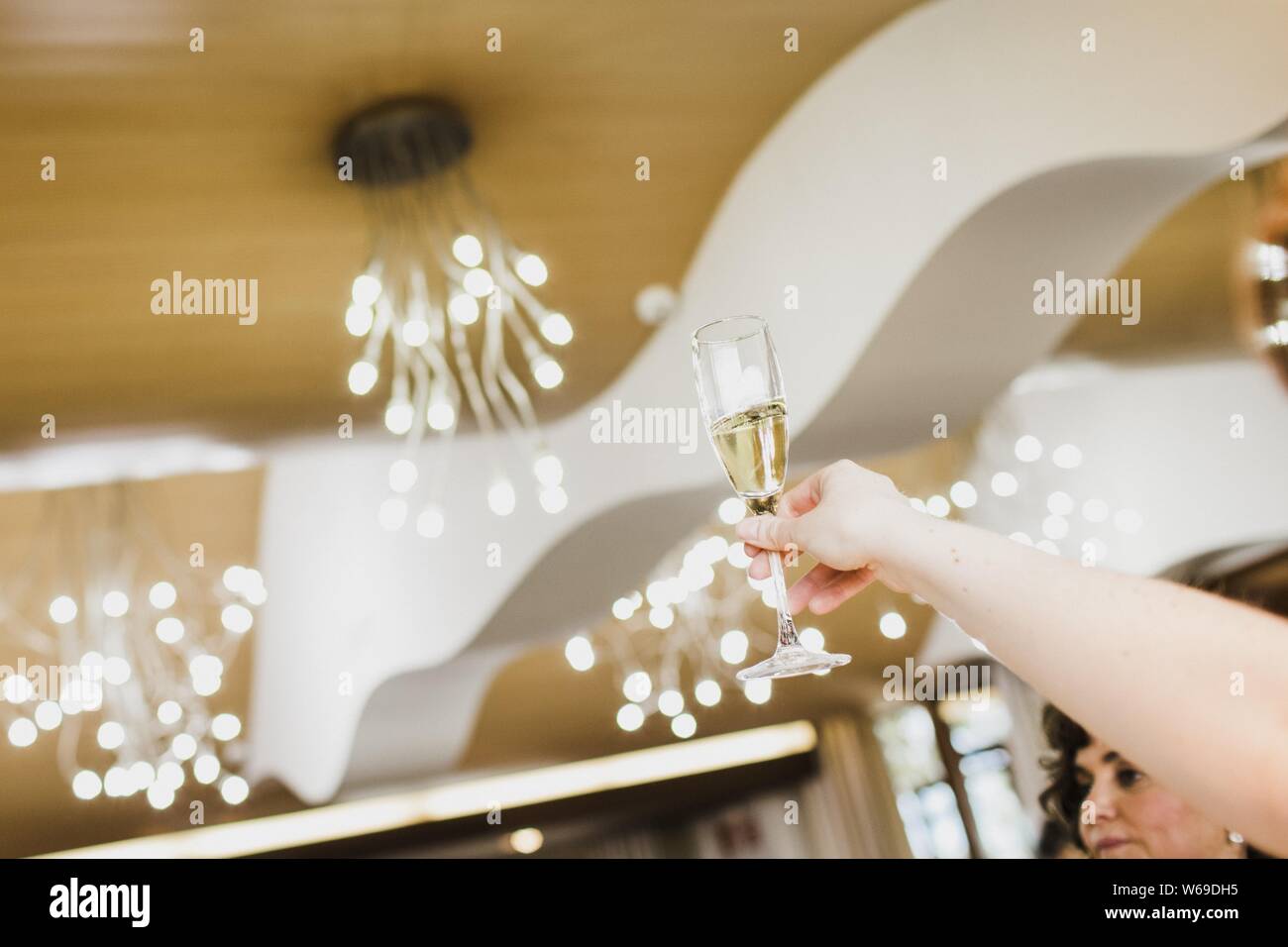 Raise a toast woman hi-res stock photography and images - Alamy