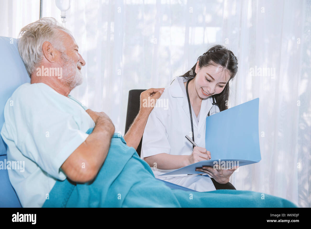 Helpful doctor taking care of patient alzheimer in healthcare hospital ...