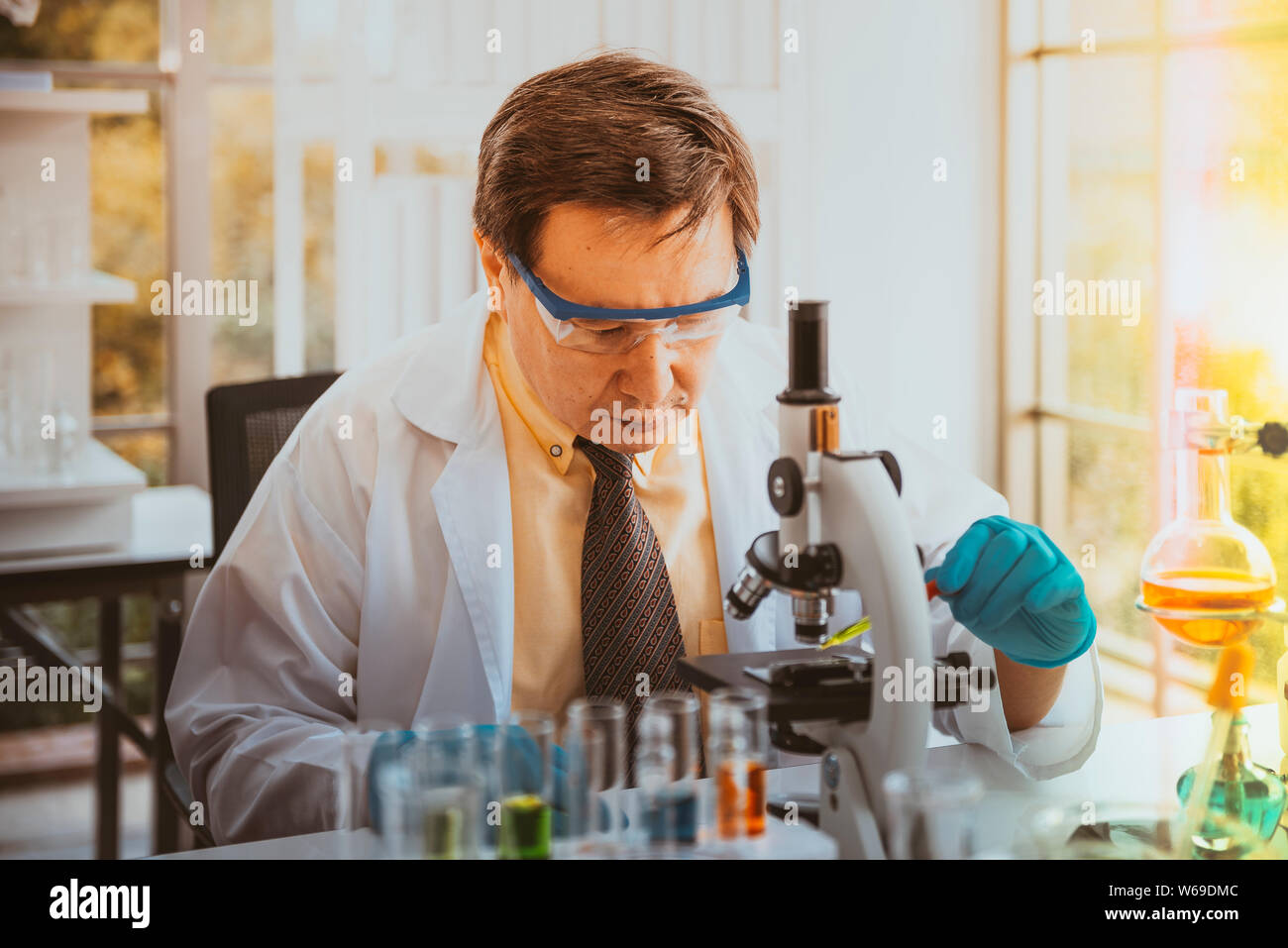 Professor testing chemistry in lab Stock Photo - Alamy
