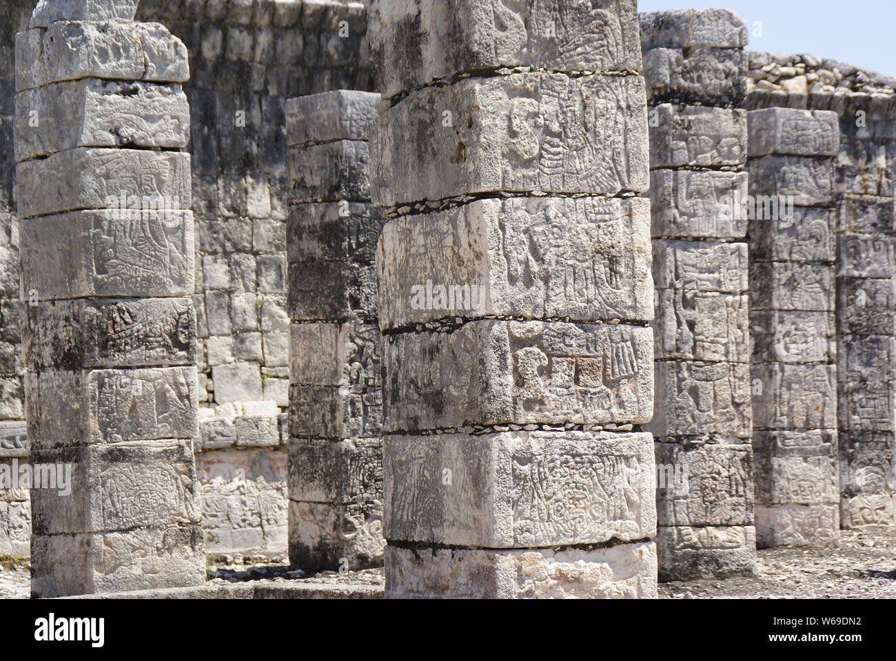 Carved stone columns with Mayan images in Chichen Itza, Mexico Stock ...
