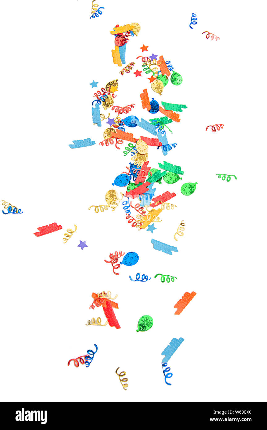 Confetti is spread out in a random pattern on a white background in ...