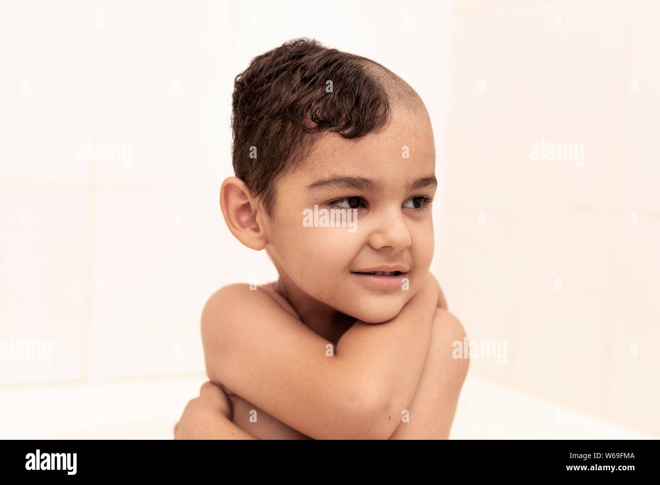 Portrait of a little middle eastern boy at the bathroom. 6-year-old ...