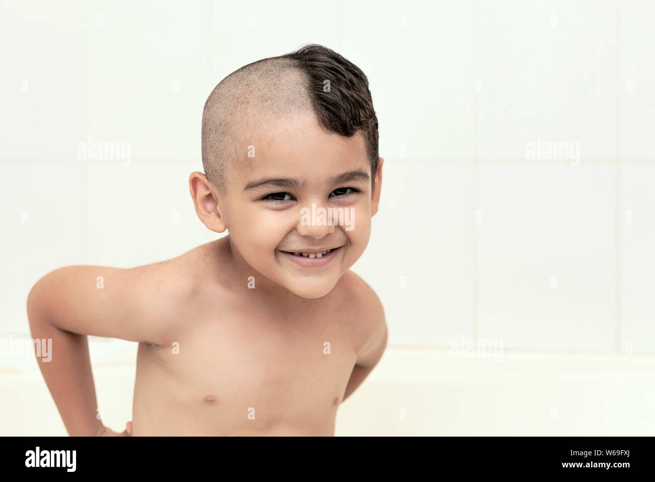 Portrait of a little middle eastern boy at the bathroom. 6-year-old ...