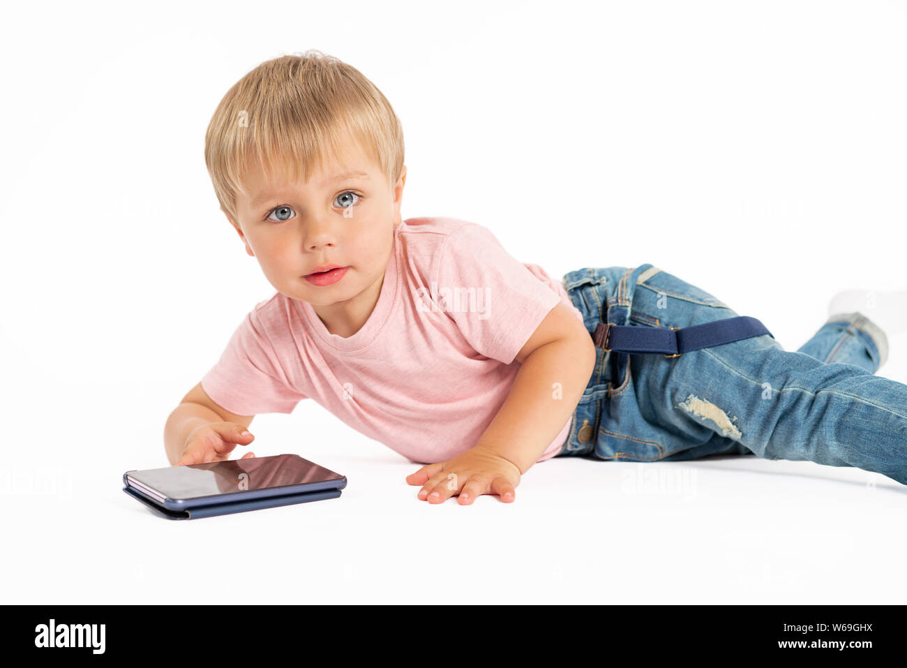 Little boy using mobile phone. Child playing on smartphone. Technology ...