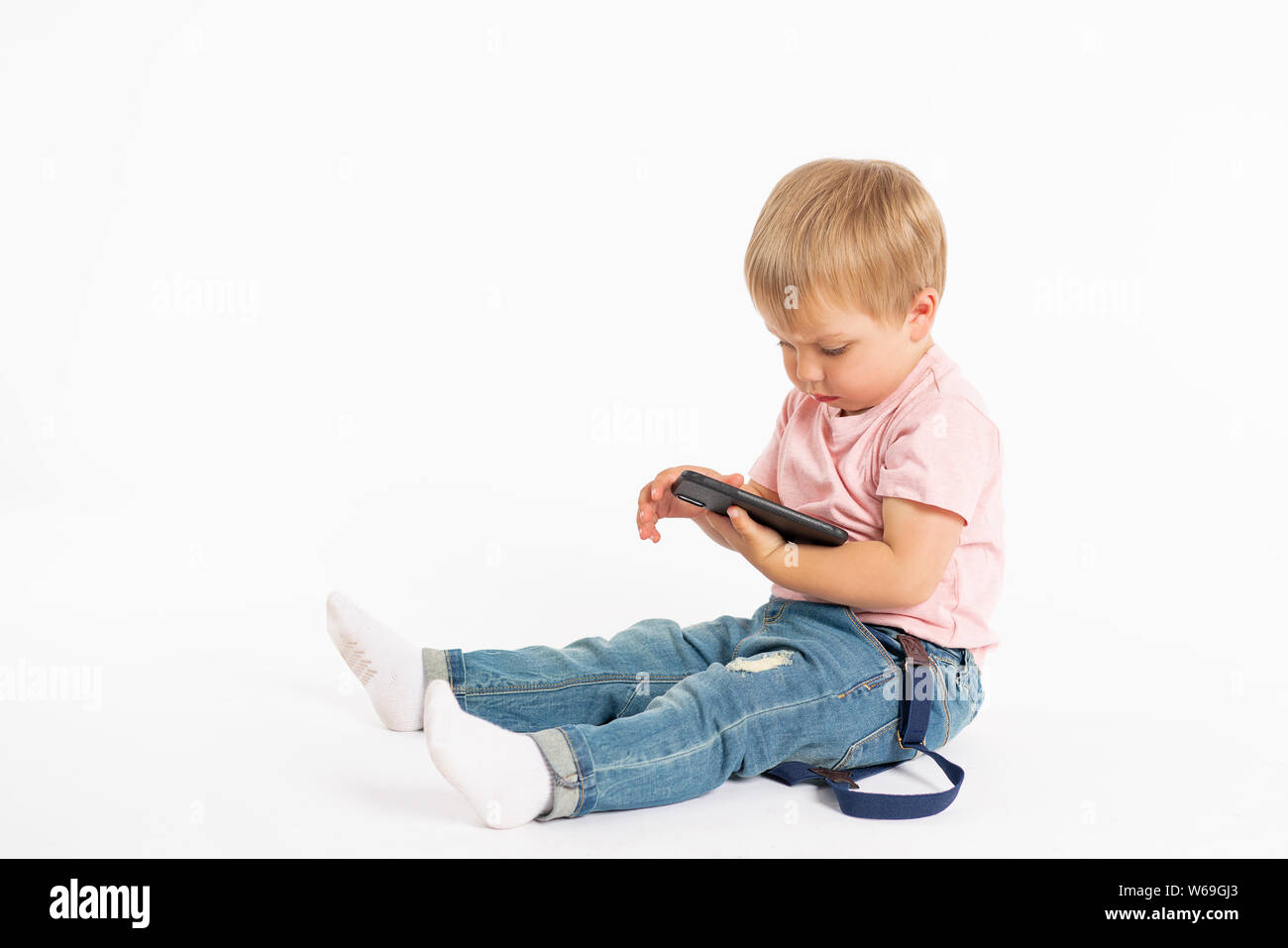 Little boy using mobile phone. Child playing on smartphone. Technology ...