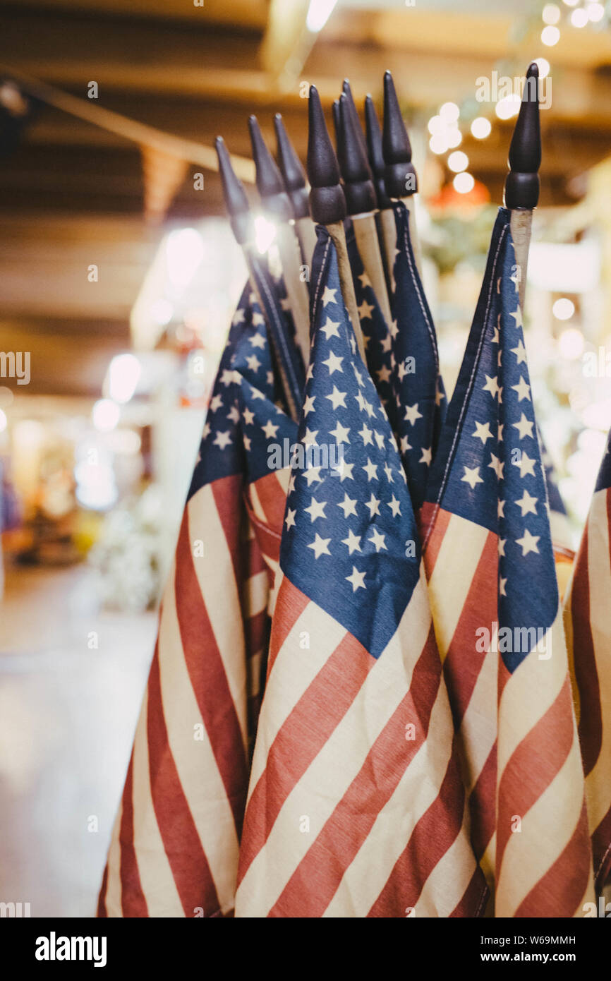 Old vintage usa faded flags symbol of freedom in store Stock Photo - Alamy