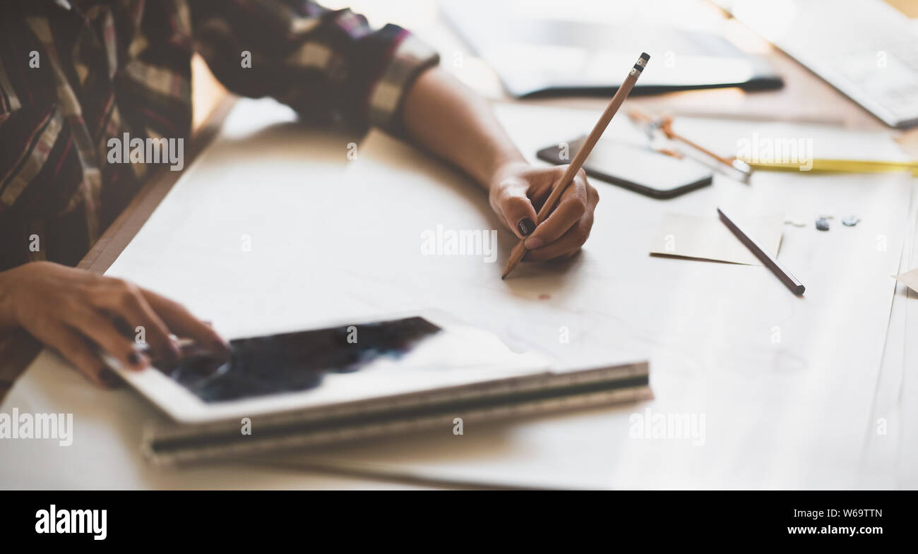 Young woman picking up laptop hi-res stock photography and images - Alamy