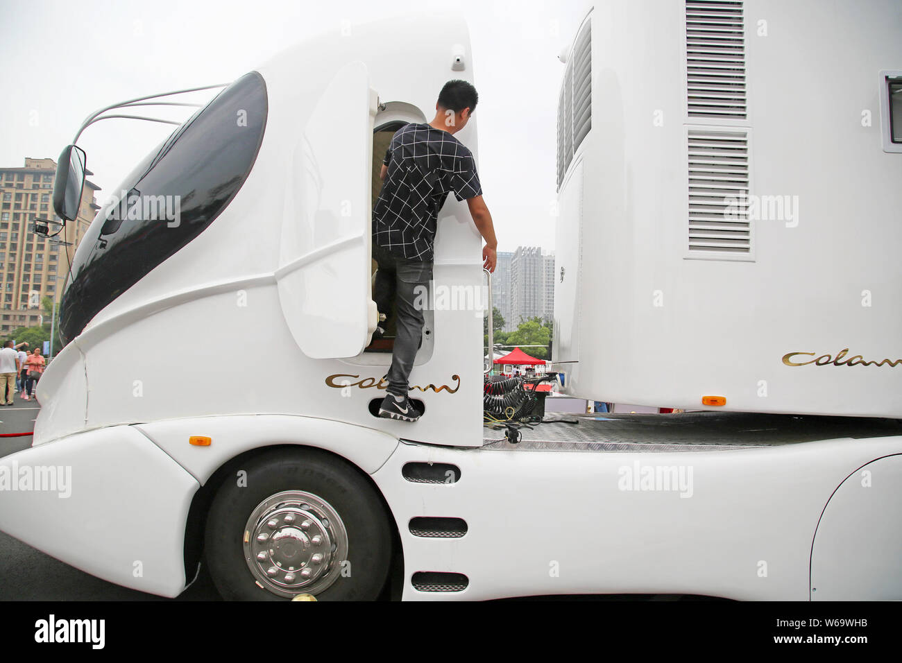 A driver gets off a luxury recreational vehicle (RV) designed by German ...