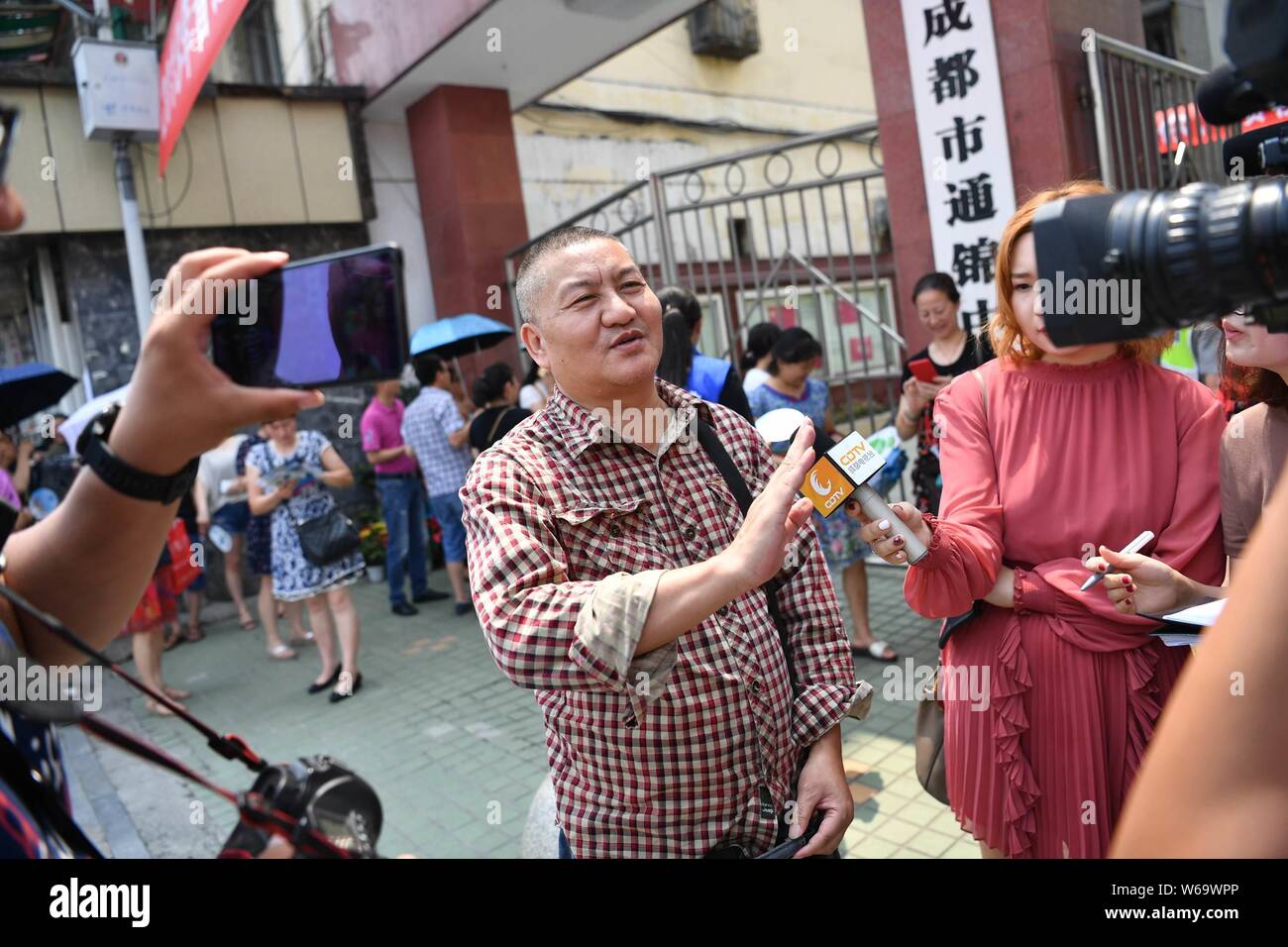 51-year-old Chinese man Liang Shi is interviewed after finishing his ...