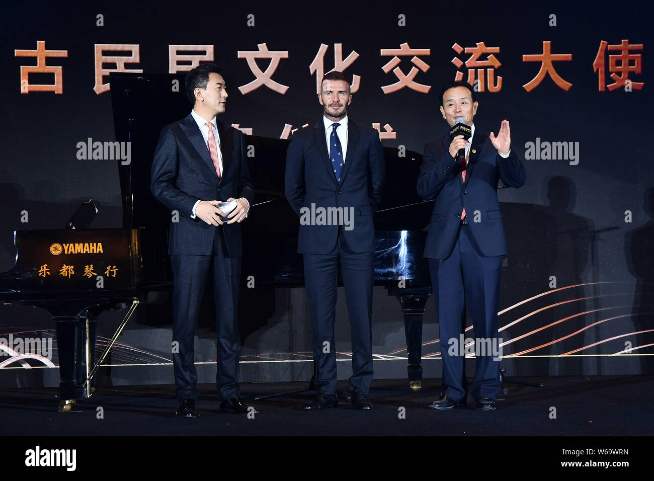 English football star David Beckham, center, attends the welcome banquet during the 2018 G-EXPO ...