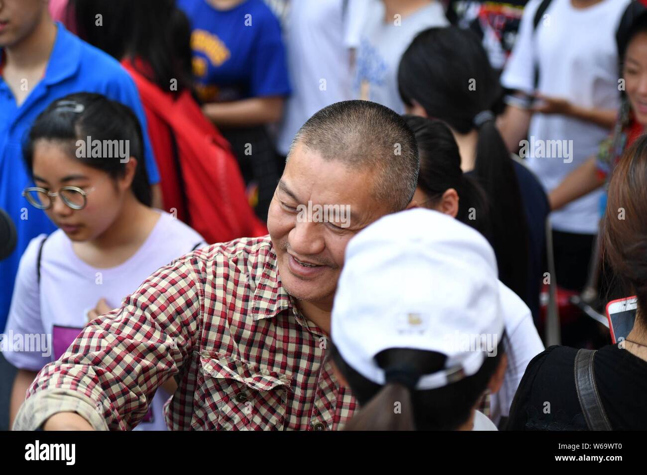 51-year-old Chinese man Liang Shi is interviewed after finishing his ...