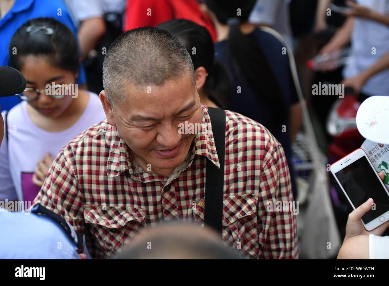 51-year-old Chinese man Liang Shi is interviewed after finishing his ...