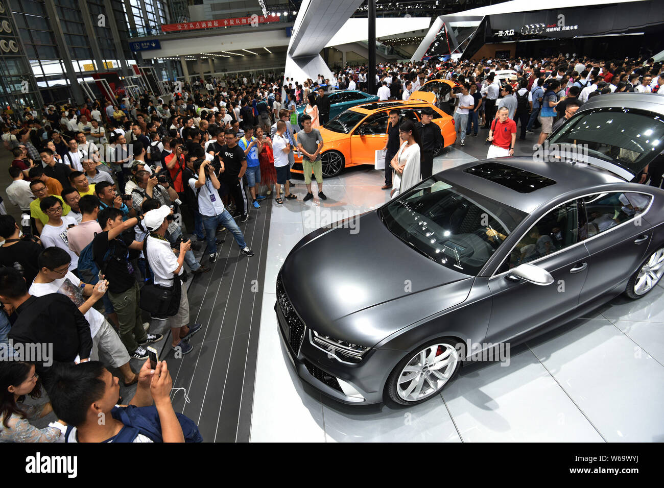 Visitors crowd the stand of Audi during the 22nd Shenzhen-Hong Kong ...