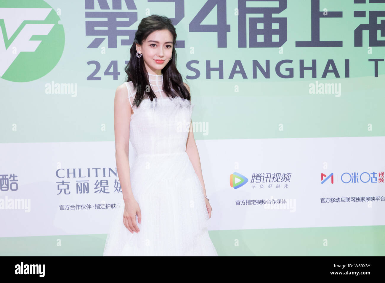 Hong Kong actress Angelababy poses as she arrives on the red carpet for the closing ceremony of ...