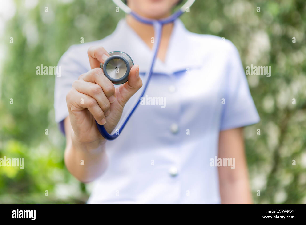 Nurse using stethoscope on patient hi-res stock photography and images ...