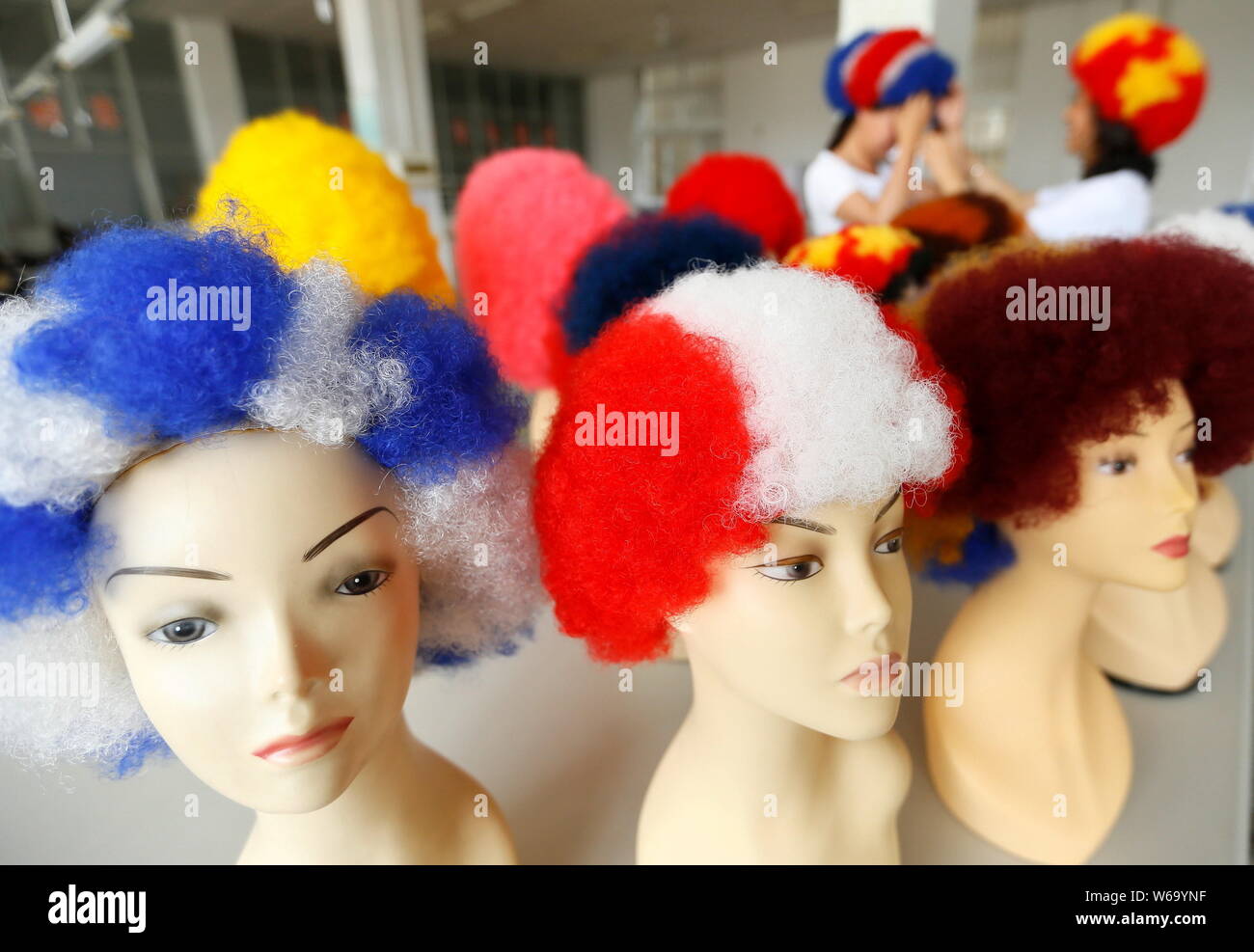 Tailor-made wigs for fans of the 2018 FIFA World Cup are on display at ...