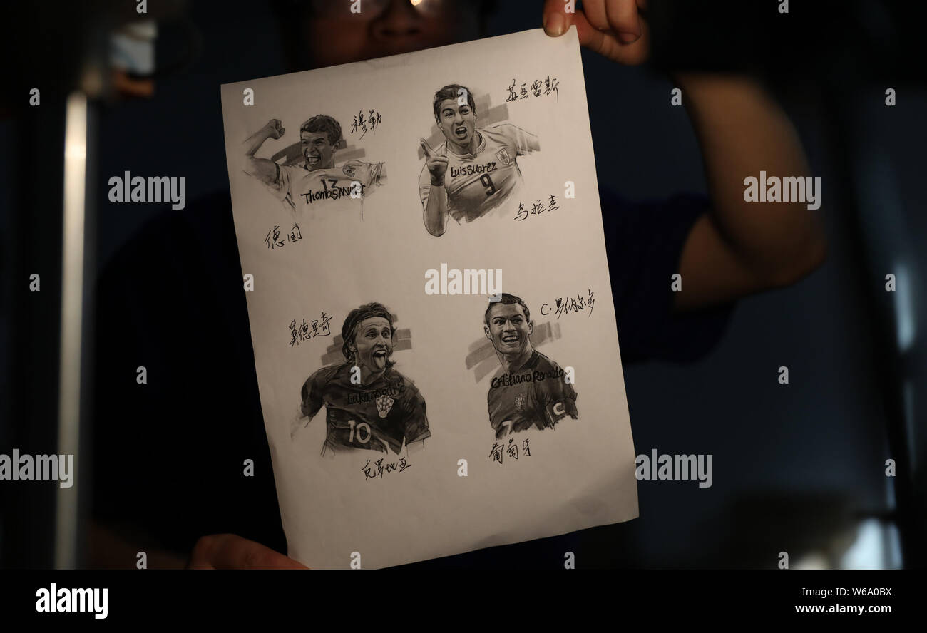 View of portraits of Thomas Muller of Germany, Luis Suarez of Uruguay ...