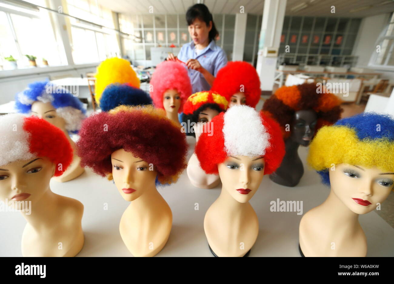 Tailor-made wigs for fans of the 2018 FIFA World Cup are on display at ...