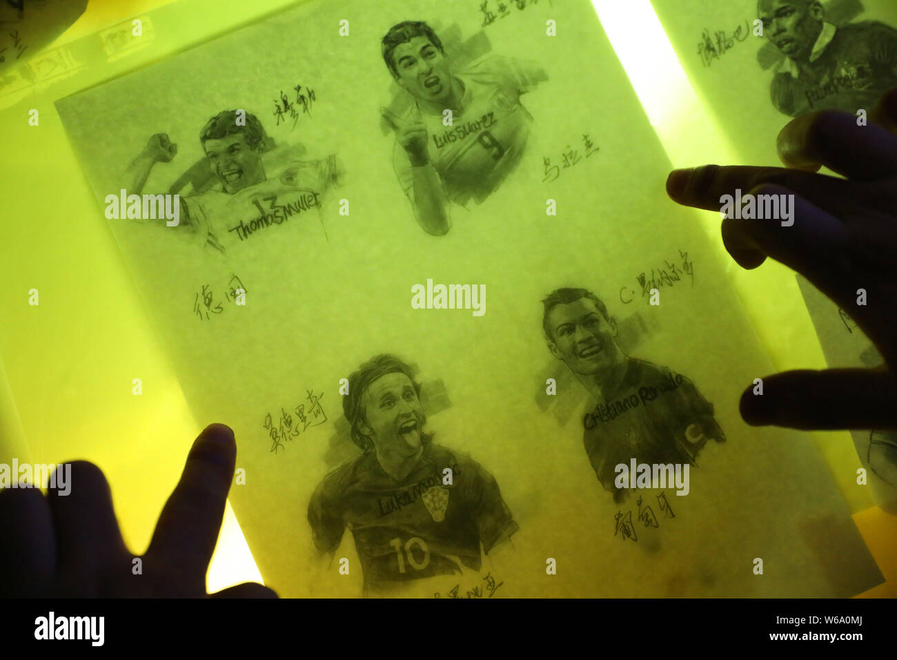 View of portraits of Thomas Muller of Germany, Luis Suarez of Uruguay ...