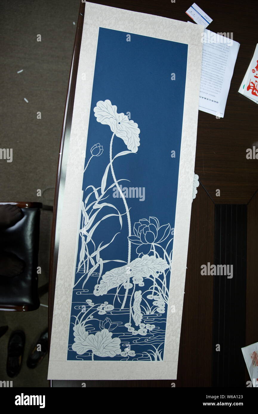 --FILE--A traditional Chinese painting cut from a piece of paper made ...