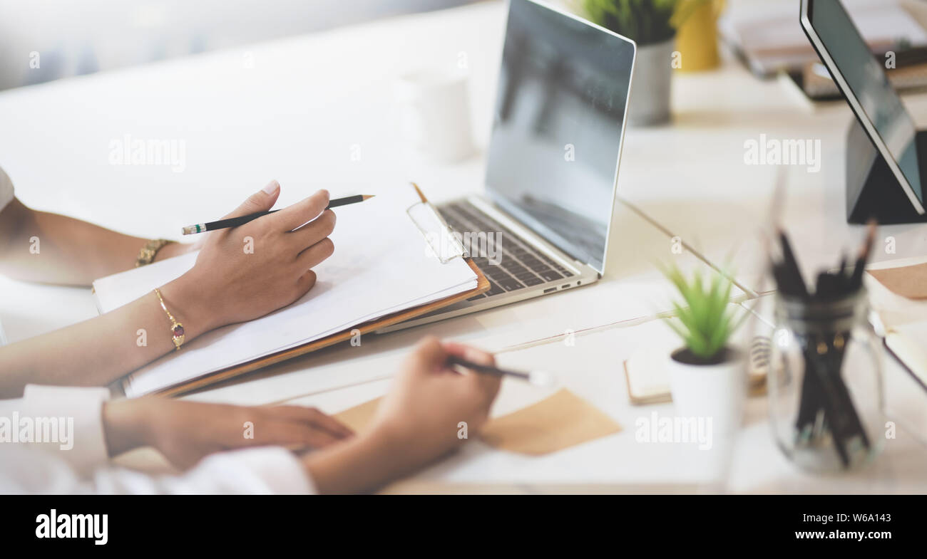 Close-up of business team briefing their strategy before the next ...