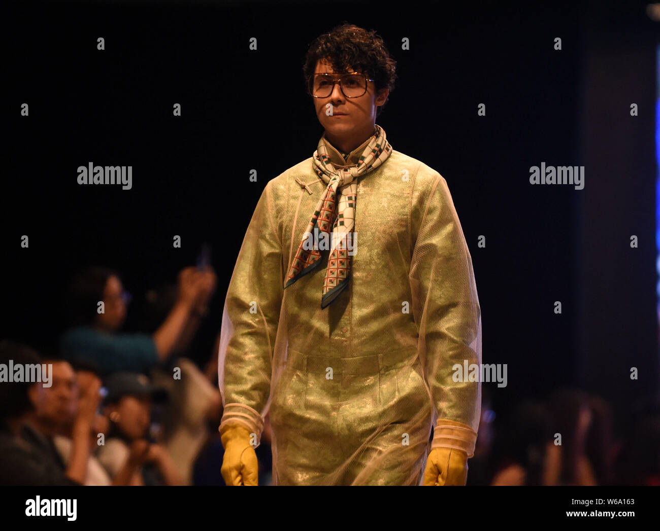 A model displays a new creation by a graduate during a fashion show for ...