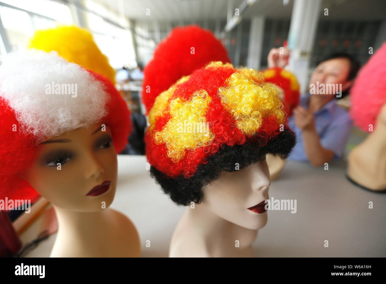 Tailor-made wigs for fans of the 2018 FIFA World Cup are on display at ...