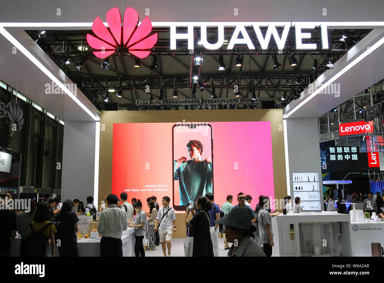 --FILE--People visit the stand of Huawei during an exhibition in ...
