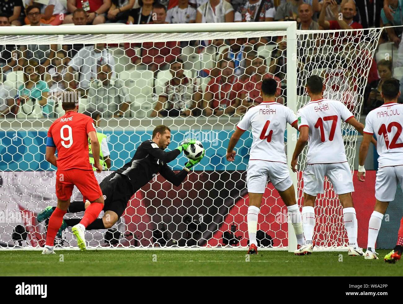Harry Kane of England, left, plays a penalty kick against goalkeeper ...