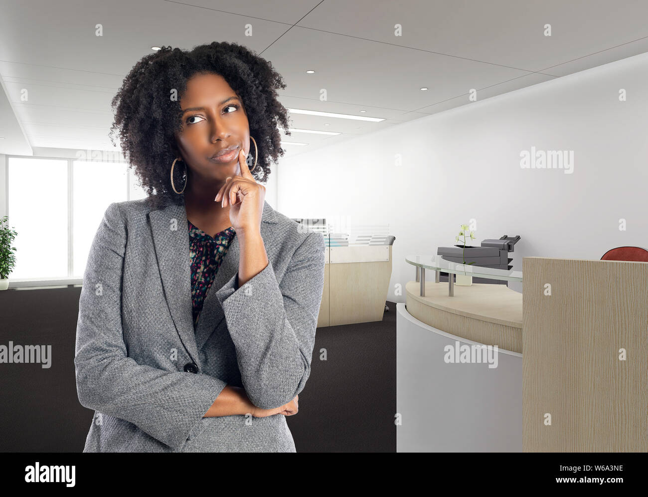 Black African American businesswoman in an office thinking of ideas ...