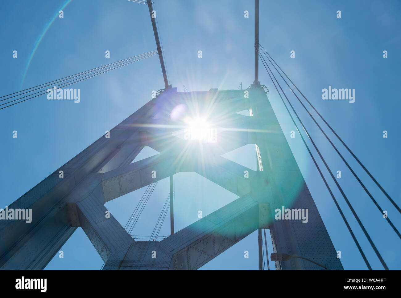 Sun shining through the tower of the Bay Bridge in San Francisco ...