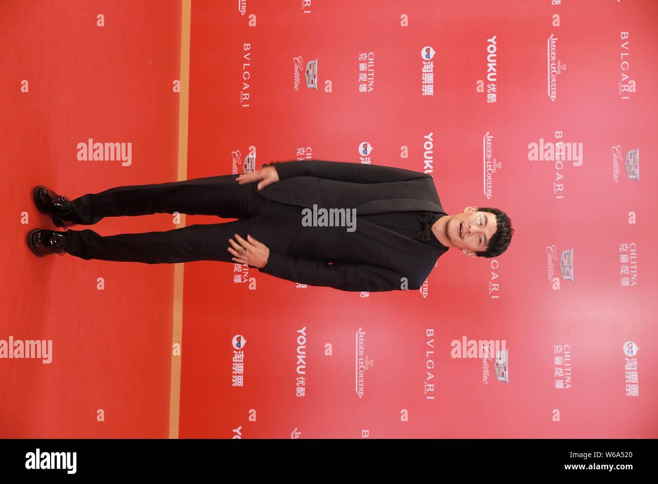Taiwanese actor Zhang Zhen poses as he arrives on the red carpet for ...