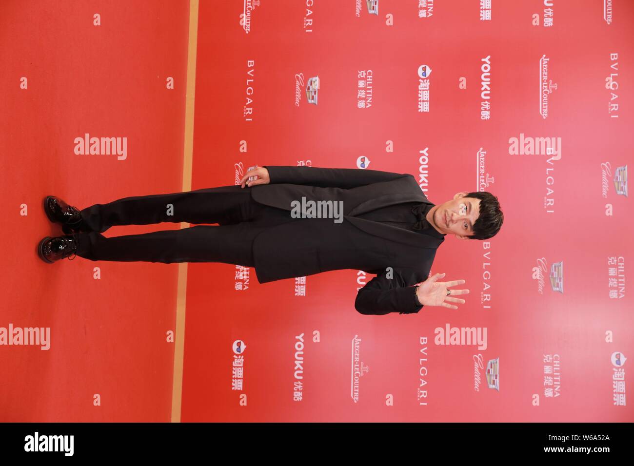Taiwanese actor Zhang Zhen poses as he arrives on the red carpet for ...