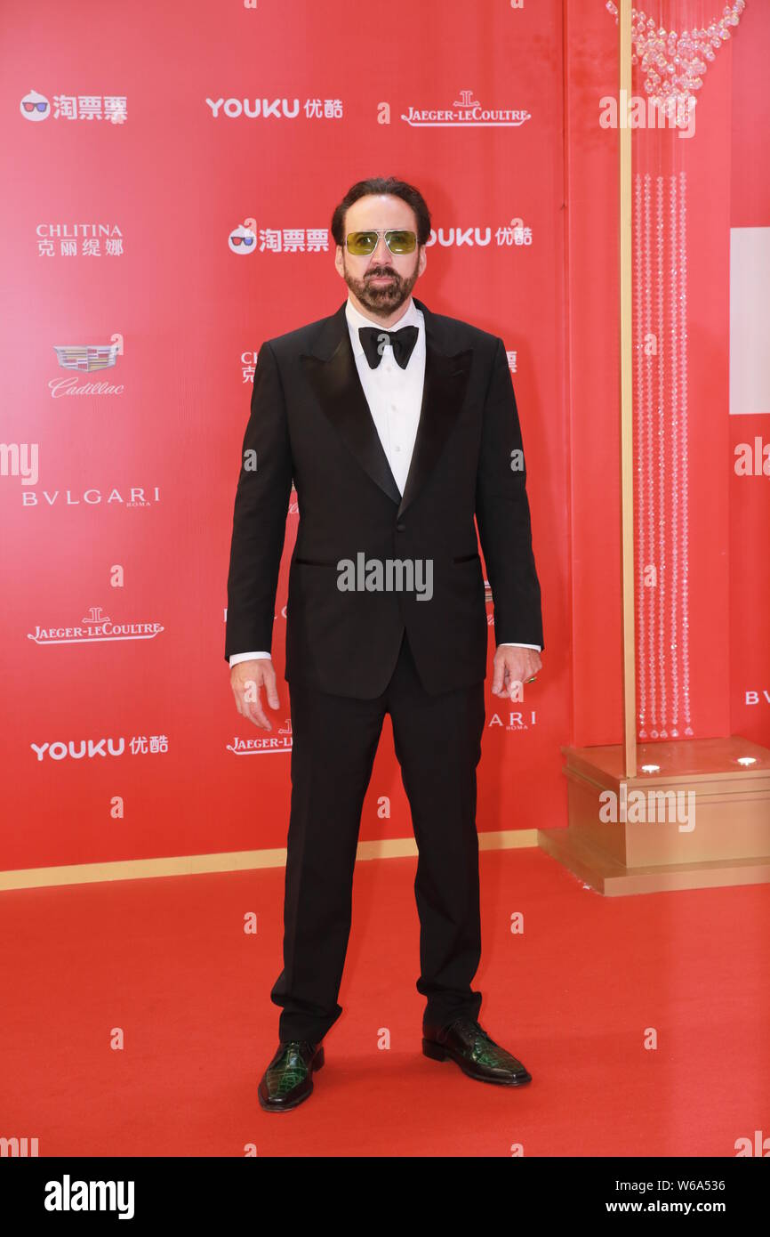 American actor and director Nicolas Cage poses as he arrives on the red ...