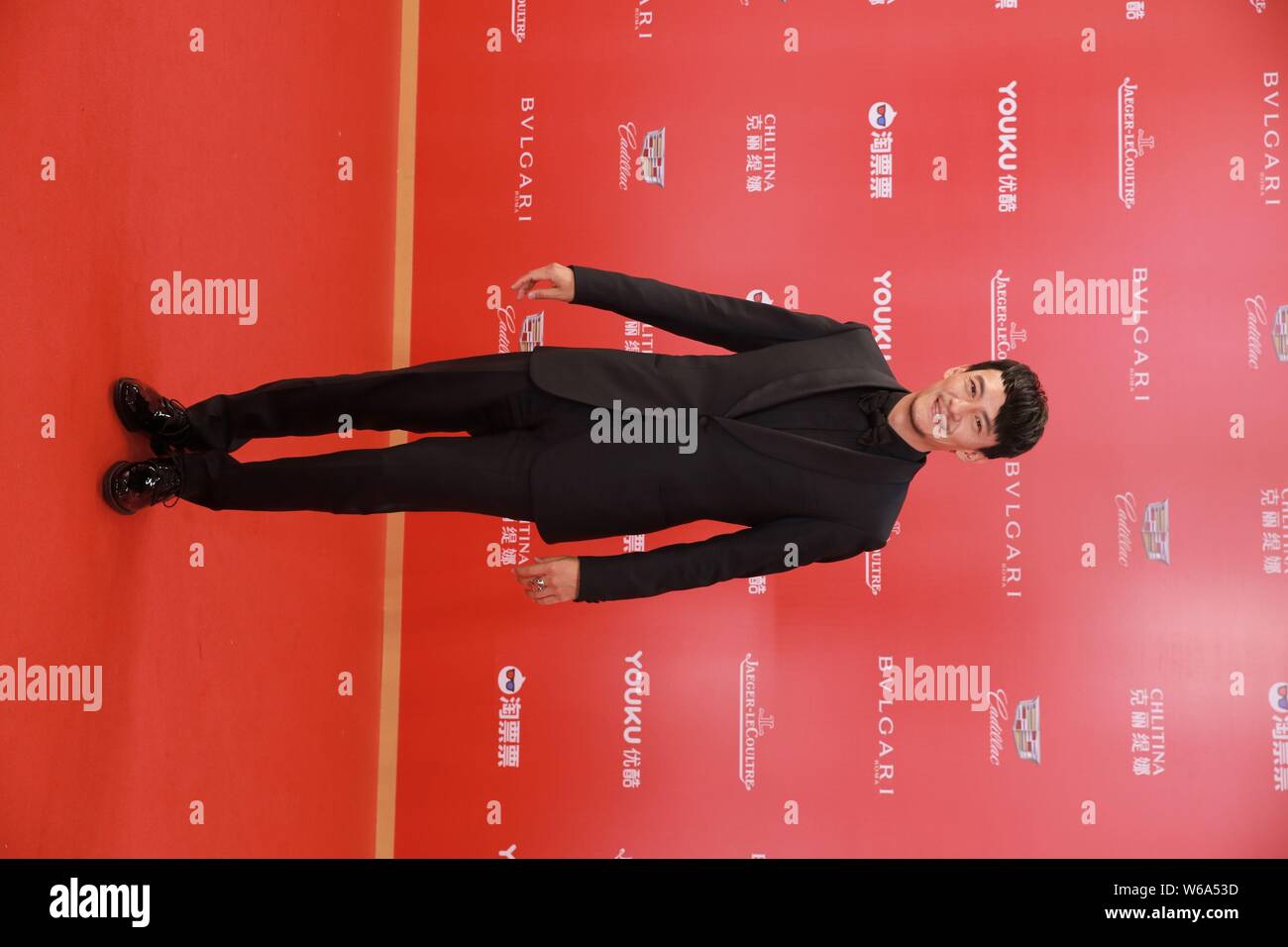 Taiwanese actor Zhang Zhen poses as he arrives on the red carpet for ...