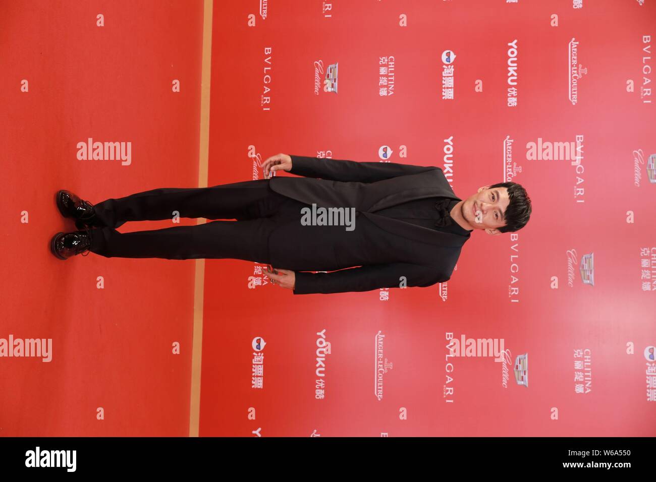 Taiwanese actor Zhang Zhen poses as he arrives on the red carpet for ...