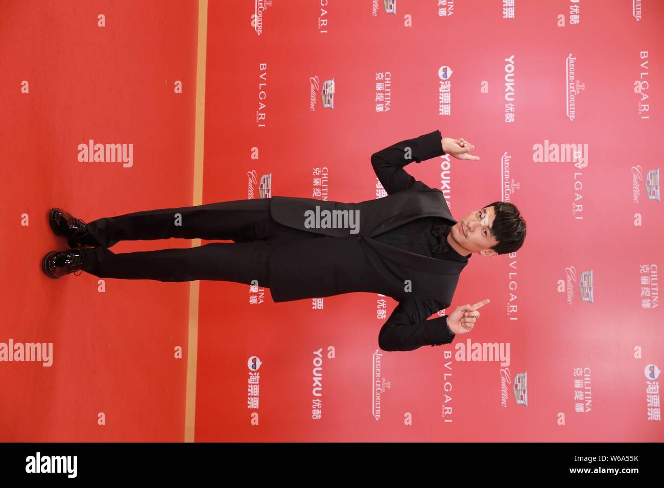 Taiwanese actor Zhang Zhen poses as he arrives on the red carpet for ...