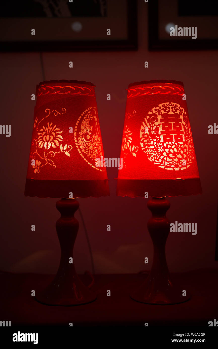 --FILE--Table lamps decorated with paper-cutting artworks are on ...
