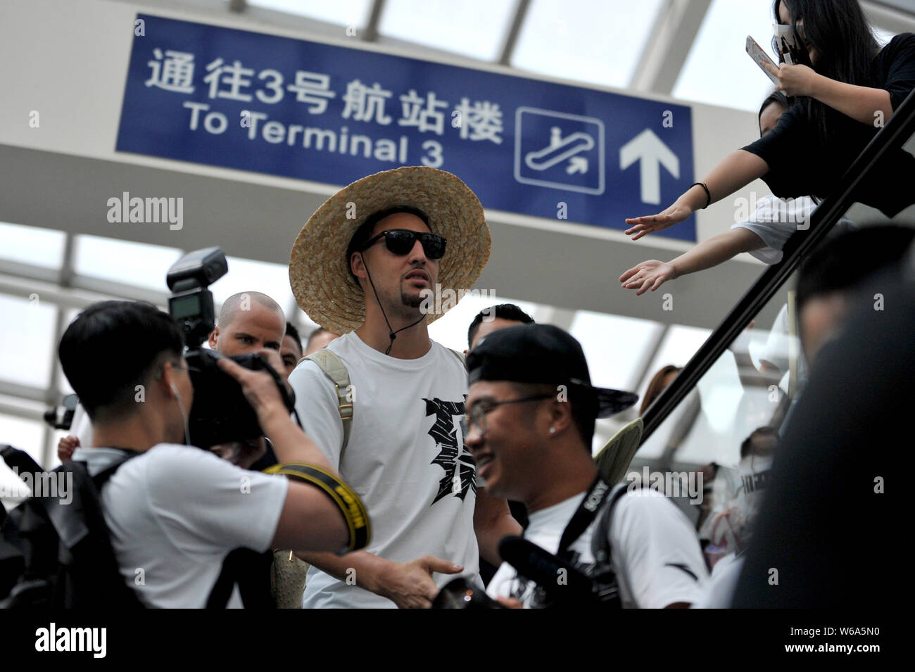 American basketball player Klay Thompson, with a straw hat on the head ...