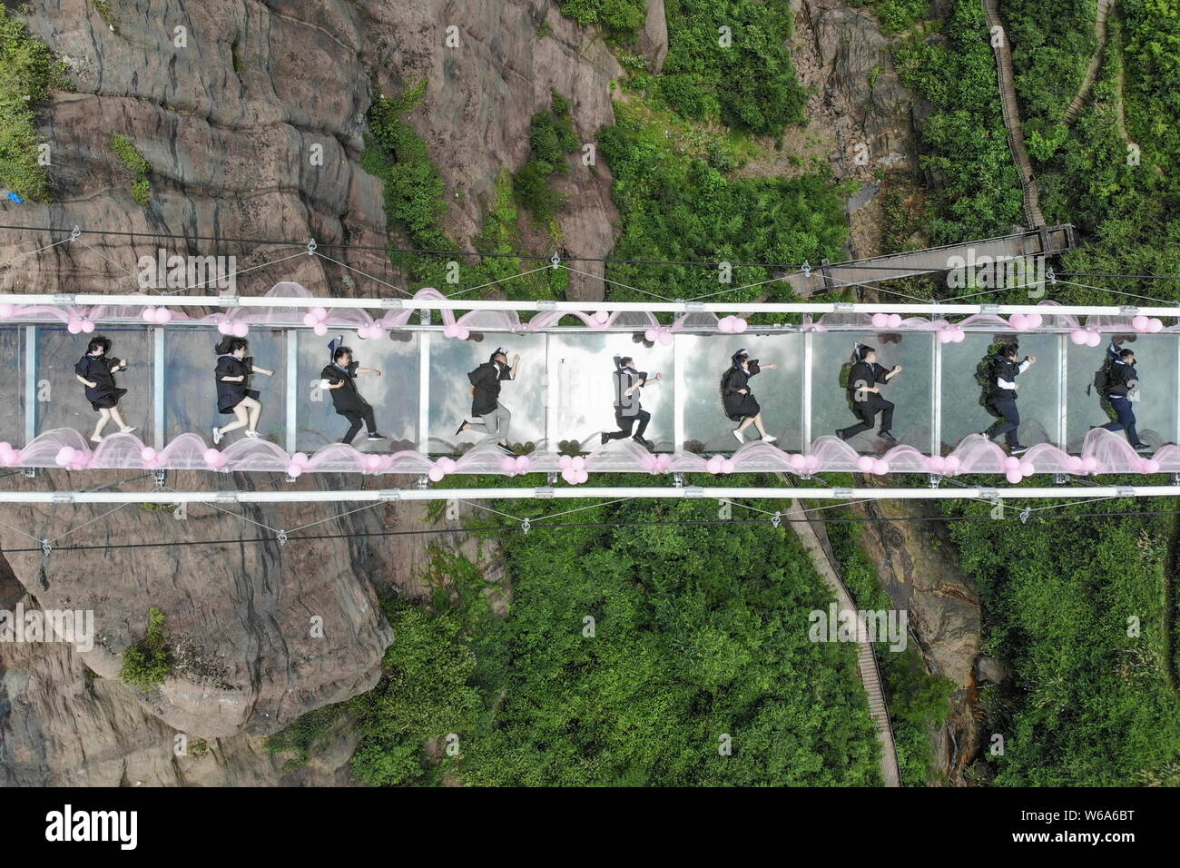 Graduates from Changsha city pose for creative graduation photos on a ...