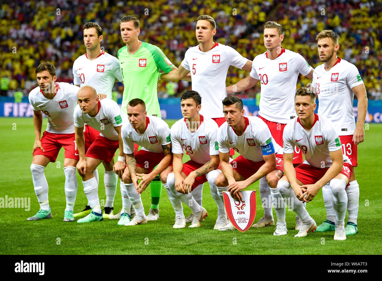 Players of the starting line-up of Poland pose for photos before their ...