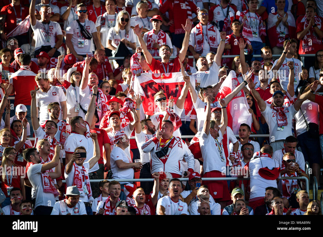 Polish football fans cheer up to show support for their team competing ...