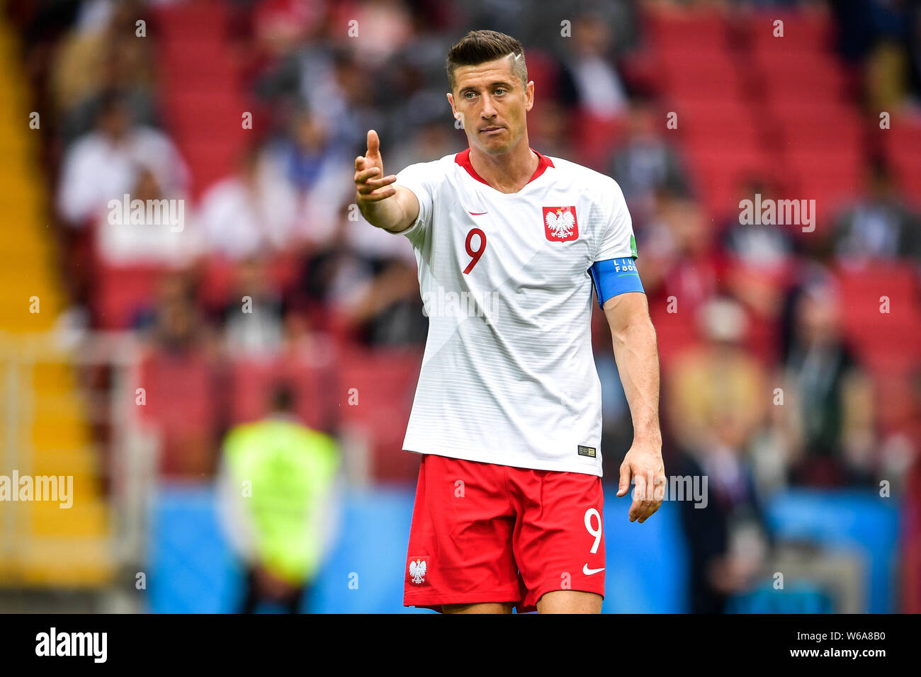 Robert Lewandowski of Poland gestures to teammates during their Group H ...
